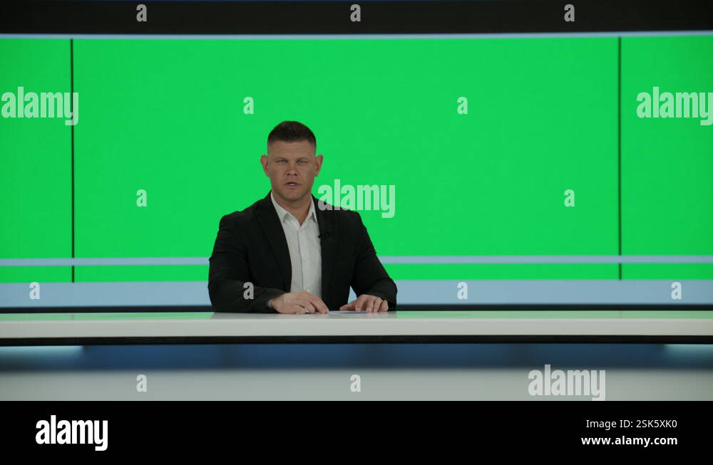 GREEN SCREEN Caucasian male anchorman reporting on a story in live news ...