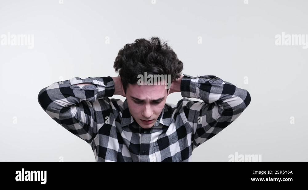 Scared Curly-haired Caucasian Man Reacts on White Background Stock ...
