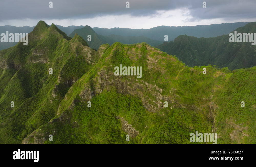 Incredible scenery of green and weird-shaped peaks over ocean coast ...
