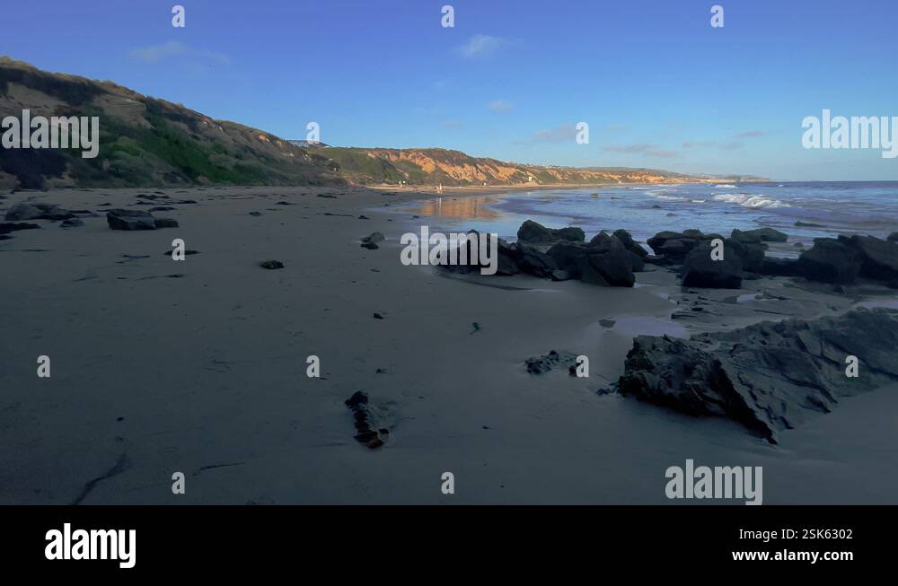 Corona Del Mar Beach with a wide angle static view of the rocks with ...