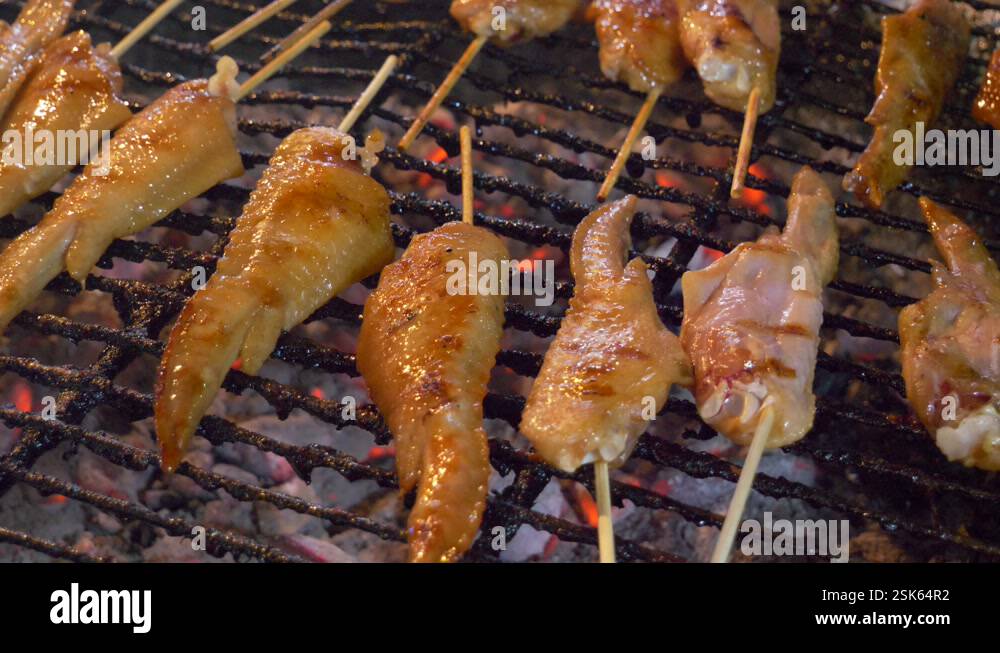 Grilled bbq charcoal roast chicken wing night market street food booth ...