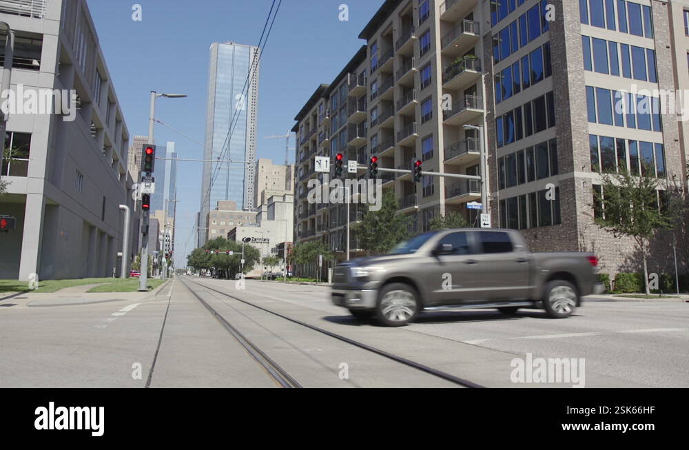 Cars passing through an intersection in downtown Houston in Texas. A ...