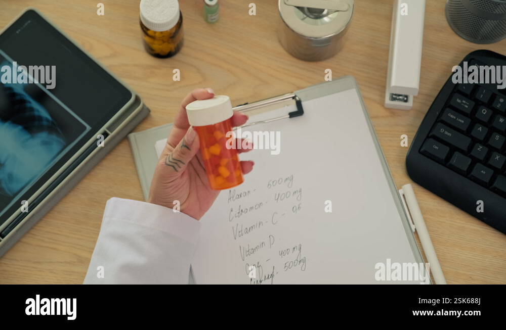 Doctor Examining Pills to Prescribe to Patient and Write Down in ...