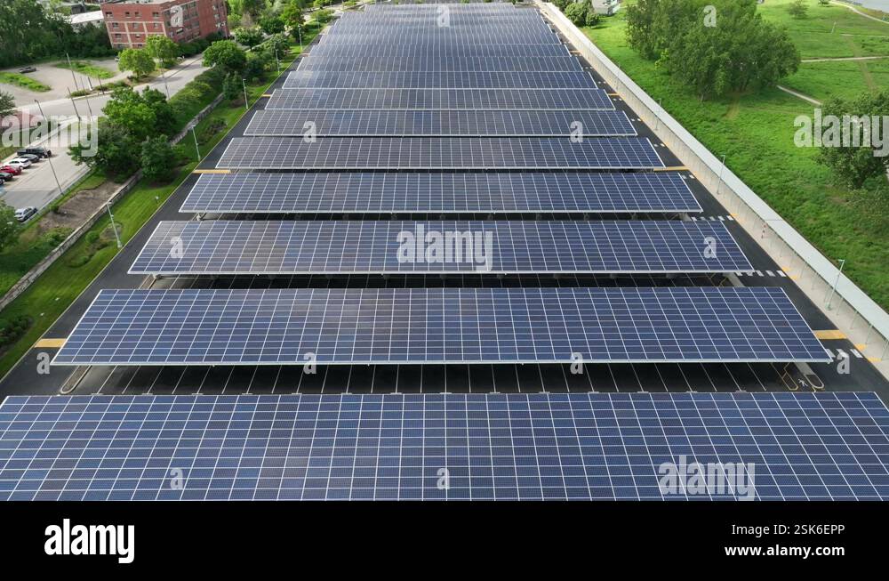 Large solar panel array. Aerial tilt up reveal of Toledo, Ohio skyline ...