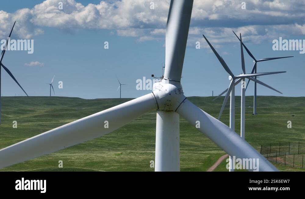 Wind turbine spinning and creating energy. Wind farm with many ...