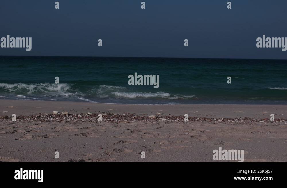 Splashing Waves On The Seashore Of Delisha Beach During Sunset In ...