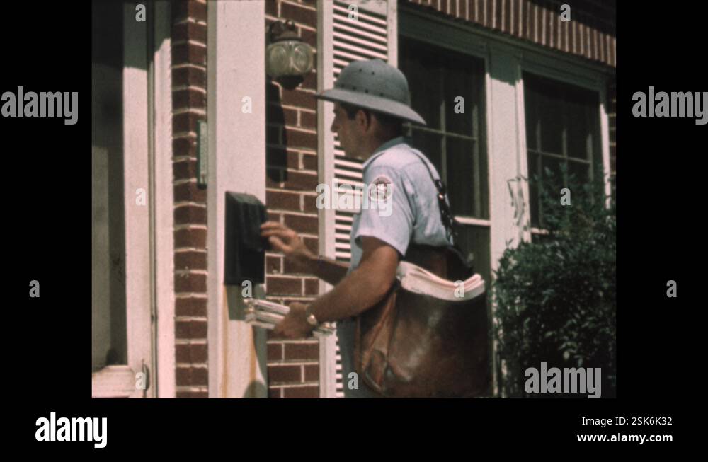 1960s: mailman in pith helmet with leather bag sorts letters on porch ...