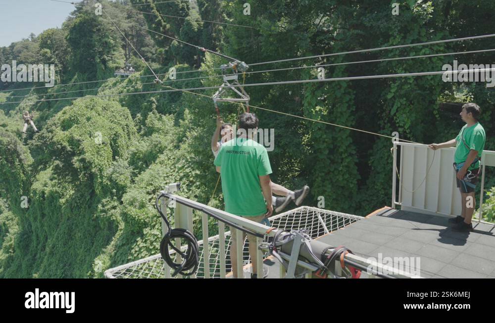 Tourists sliding down the zipline at Batumi botanical garden Stock ...
