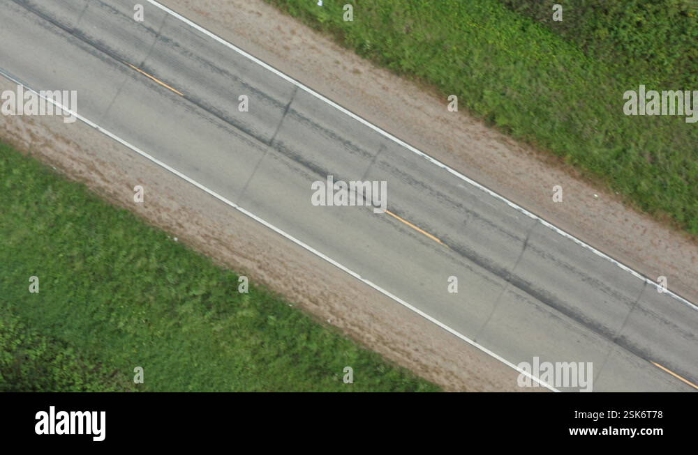 Diagonal Aerial View of Rural Two-Lane Road, Drone Flying Right to Left ...