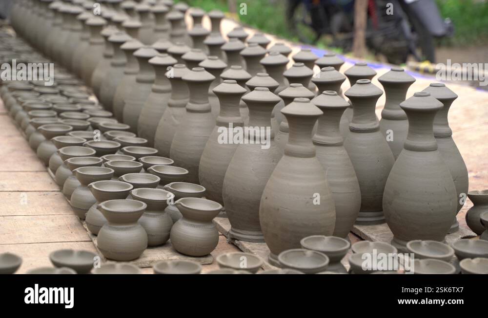 Various items made of clay are left to dry in the sun Stock Video ...