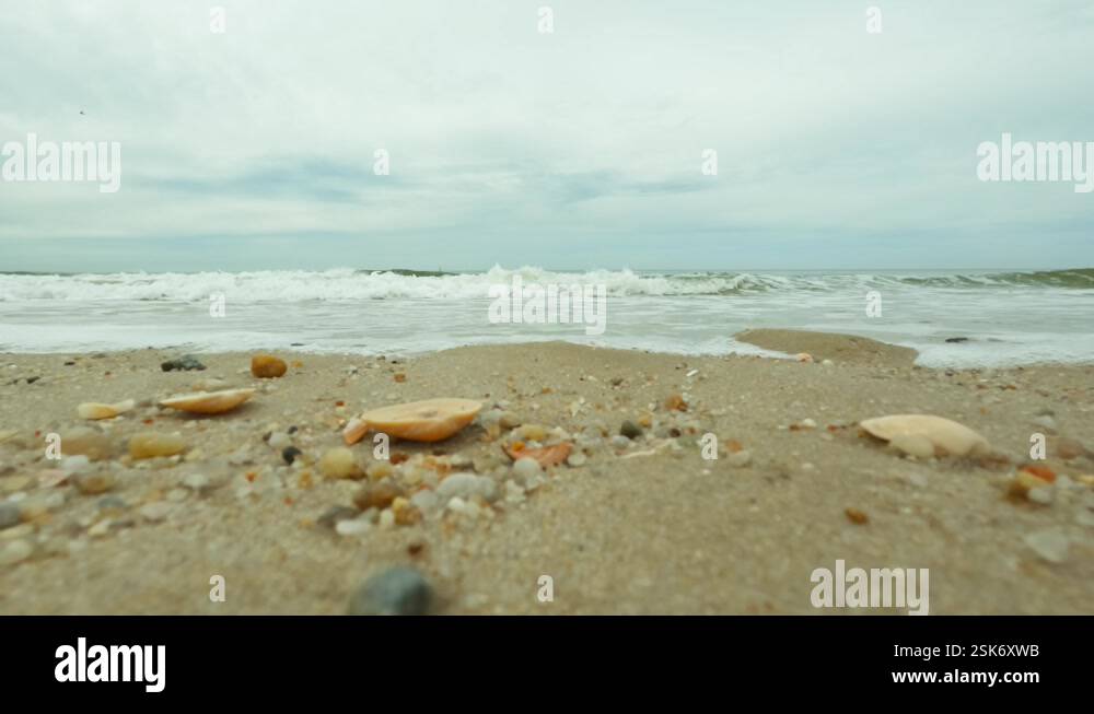 Coming wave on a beach from very low perspective Stock Video Footage ...