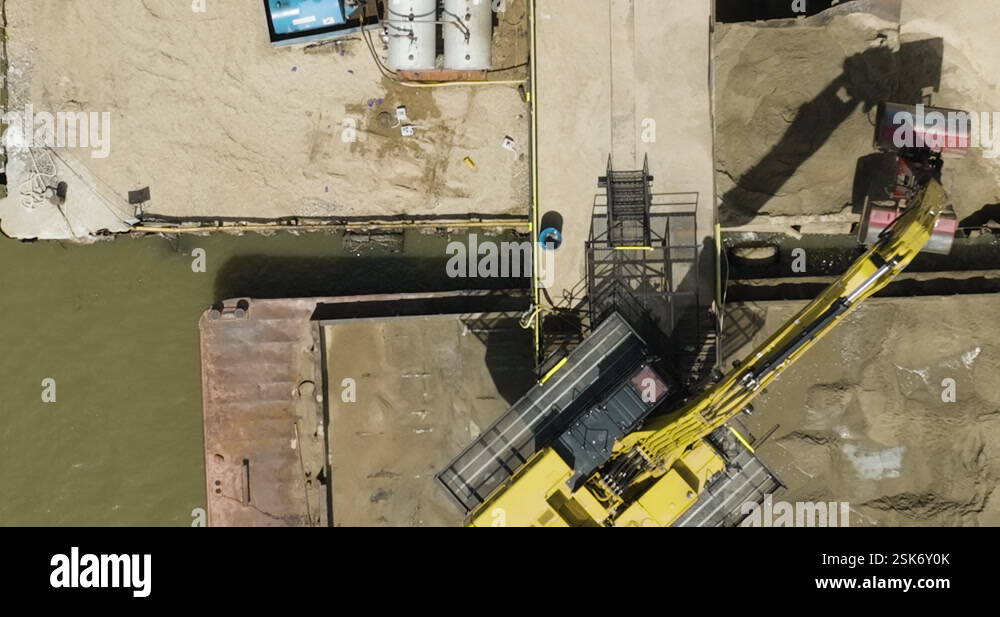 Clamshell Bucket Machinery Unloading Sand From Barge At The Sand And ...