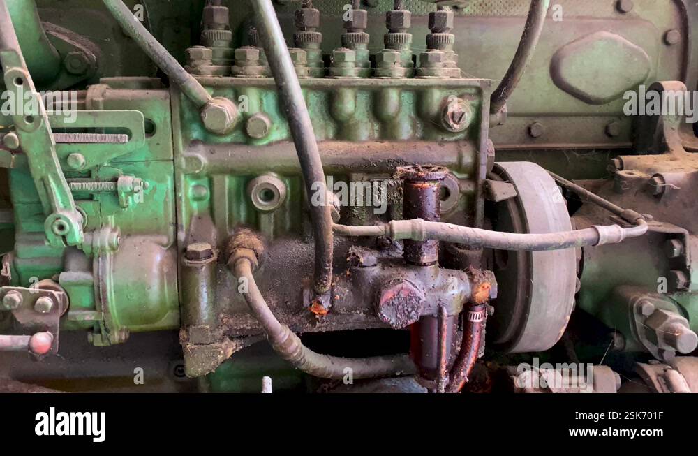 Detail shot of old emergency diesel generator with seeping oil. The ...