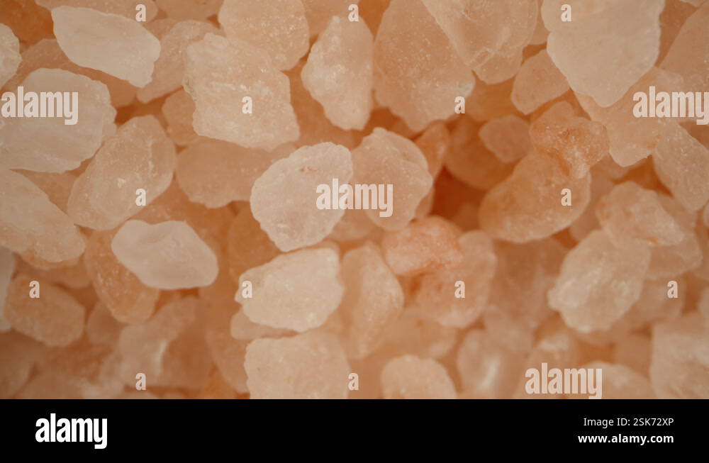 A cluster of pink sea salt crystals, top-down view. Dolly slider ...