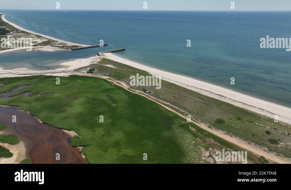Vast blue Atlantic Ocean with Pamet Harbor Cape Cod seashore in summer ...