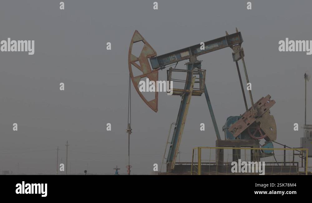 Oil industry, Pumping petroleum Rig in desert. Pump Jack Extracting ...