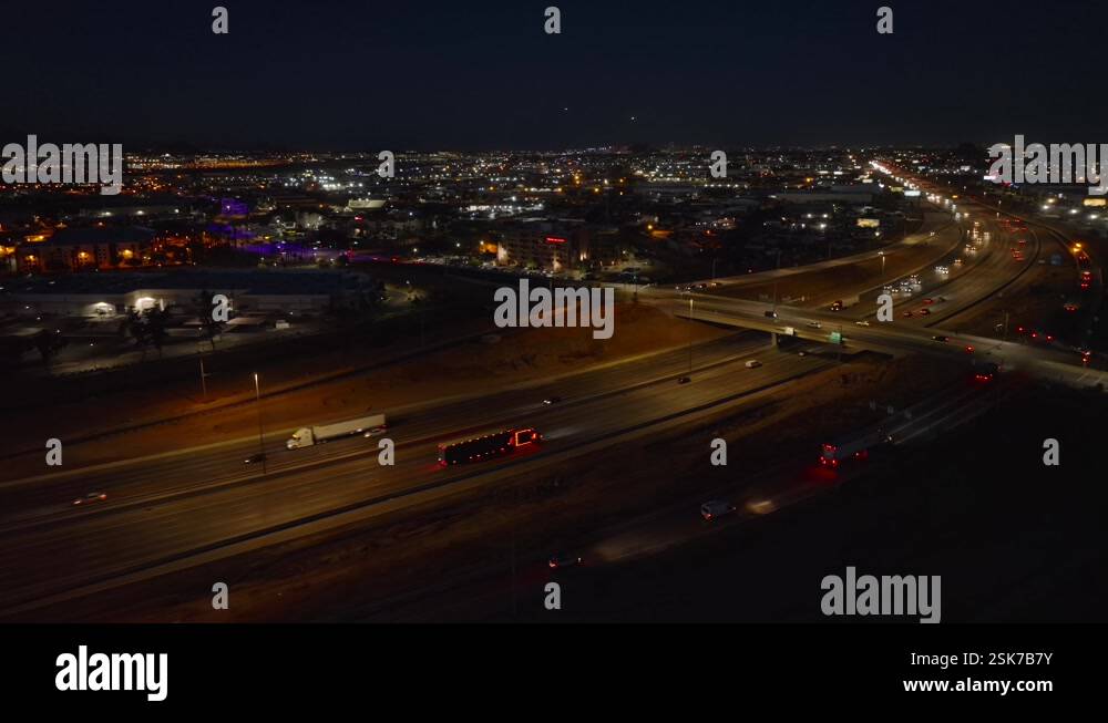 Heavy highway traffic outside of Phoenix, Arizona at night. Aerial ...