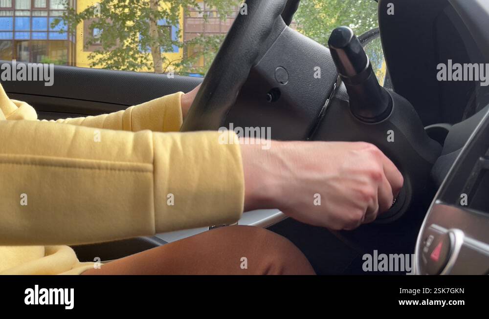 Women driver hand inserting car key and starting engine Stock Video ...