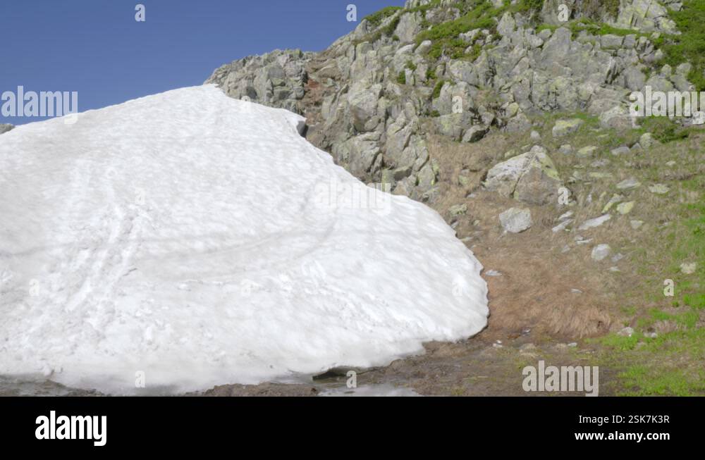 Ice on the Rhone Glacier in Switzerland. Frozen snow sliding down slope ...