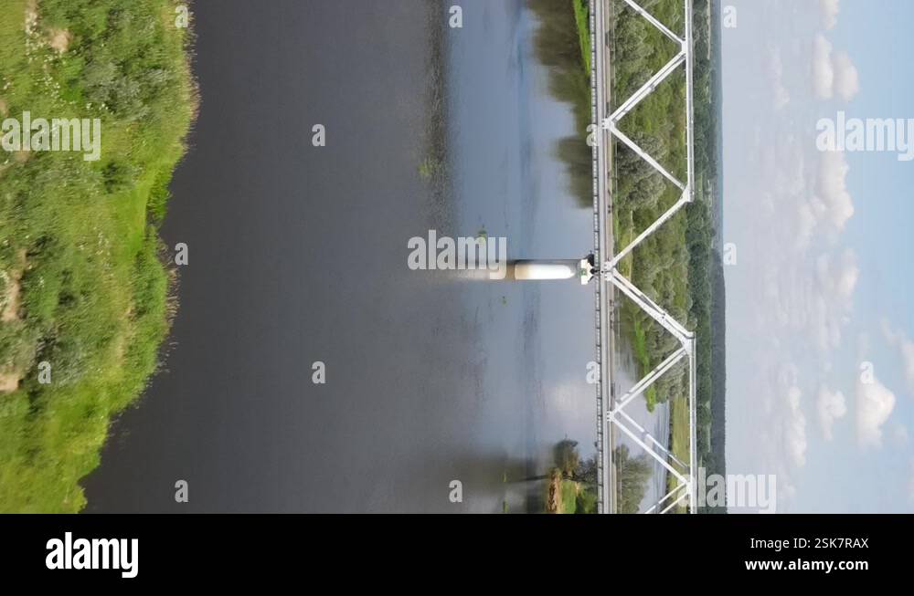 vertical aerial view of a reinforced concrete transport bridge over a ...