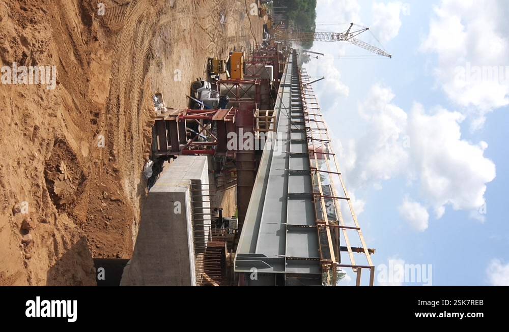 vertical construction site of modern reinforced concrete bridge across river Stock Video Footage ...