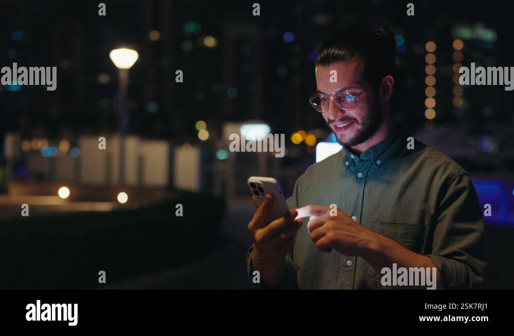 Handsome Guy Scrolling Social Media, Standing in the Night Street Stock ...