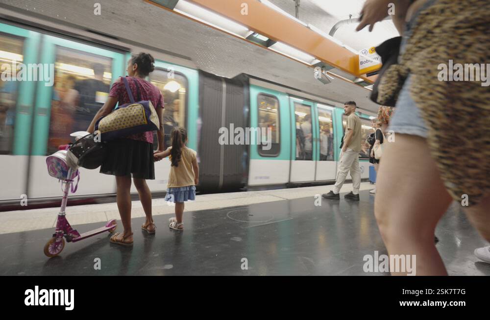 Paris, France. June 25 2023. People board crowded trains in the metro ...