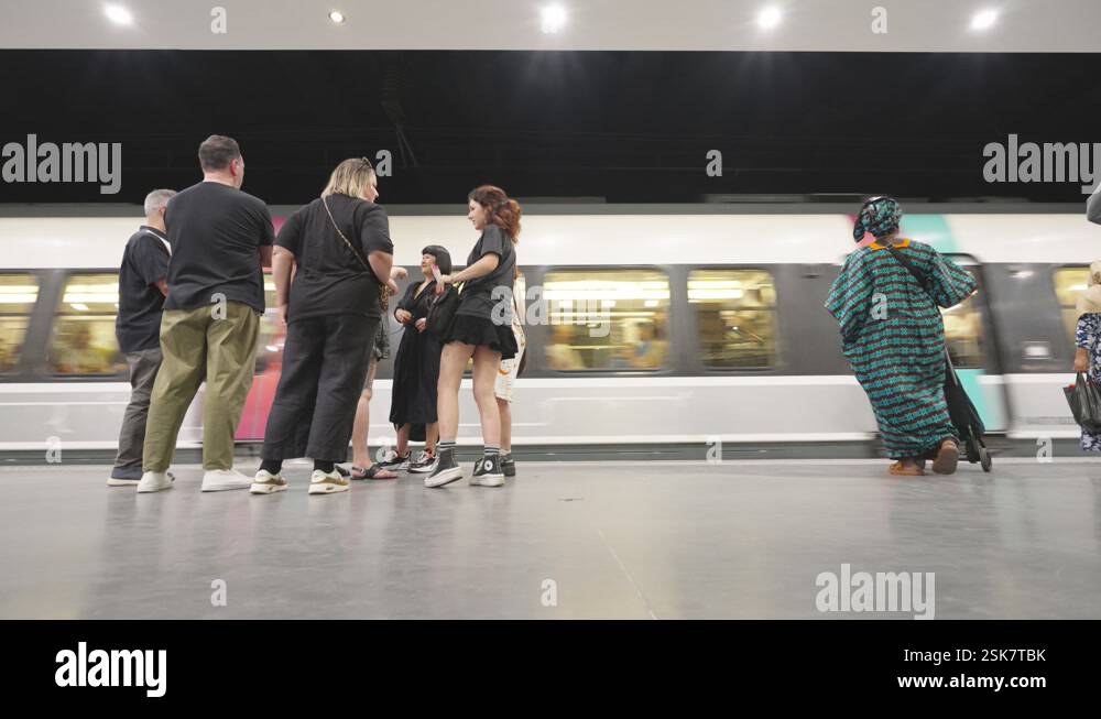 Paris, France. June 25 2023. People board crowded trains in the metro ...