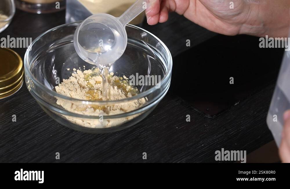 The process of making a peel-off mask mixing water and powder Stock ...