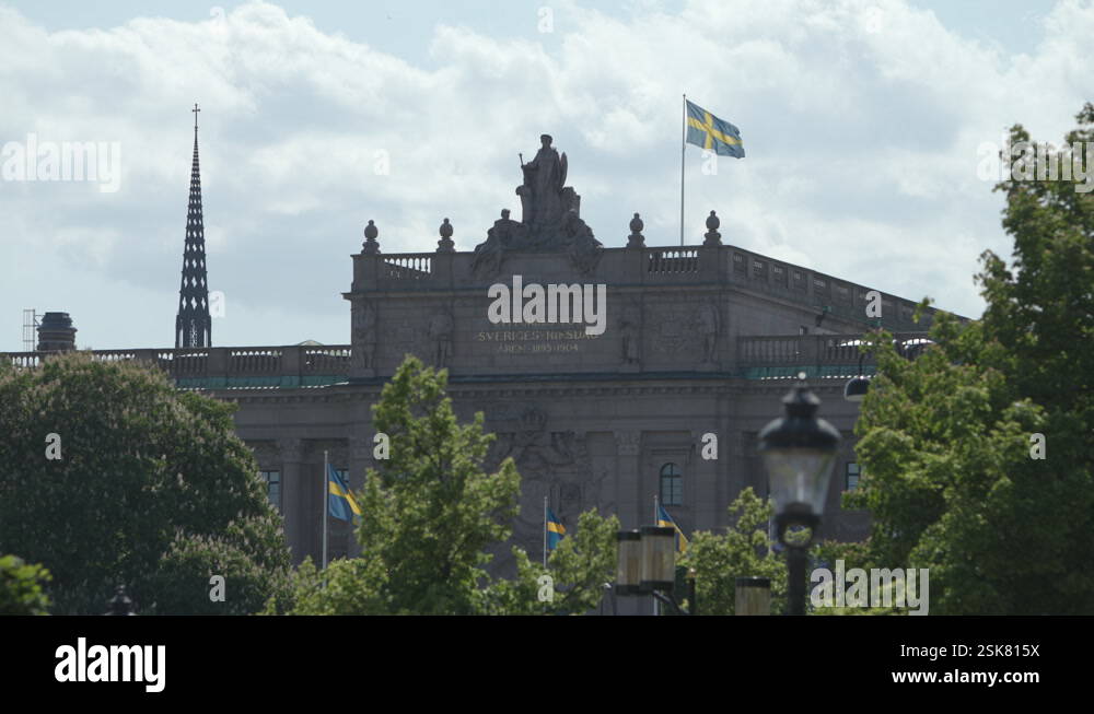 Swedish flag moves in wind on top of Parliament building in Stockholm ...