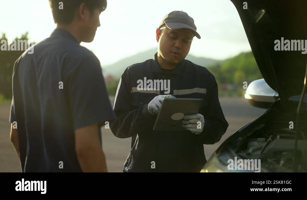 Car owner handshake to thank the skilled mechanic who repaired and take ...