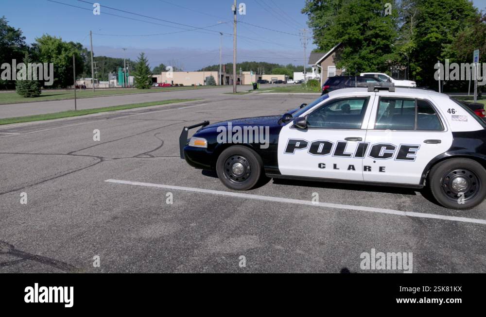 Clare, Michigan police car parked with gimbal video panning left to ...