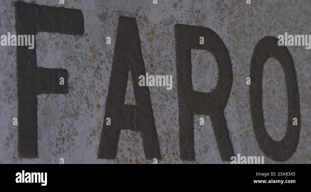 Farol sign closeup pointing to famous Nazare, Portugal surf beach break ...