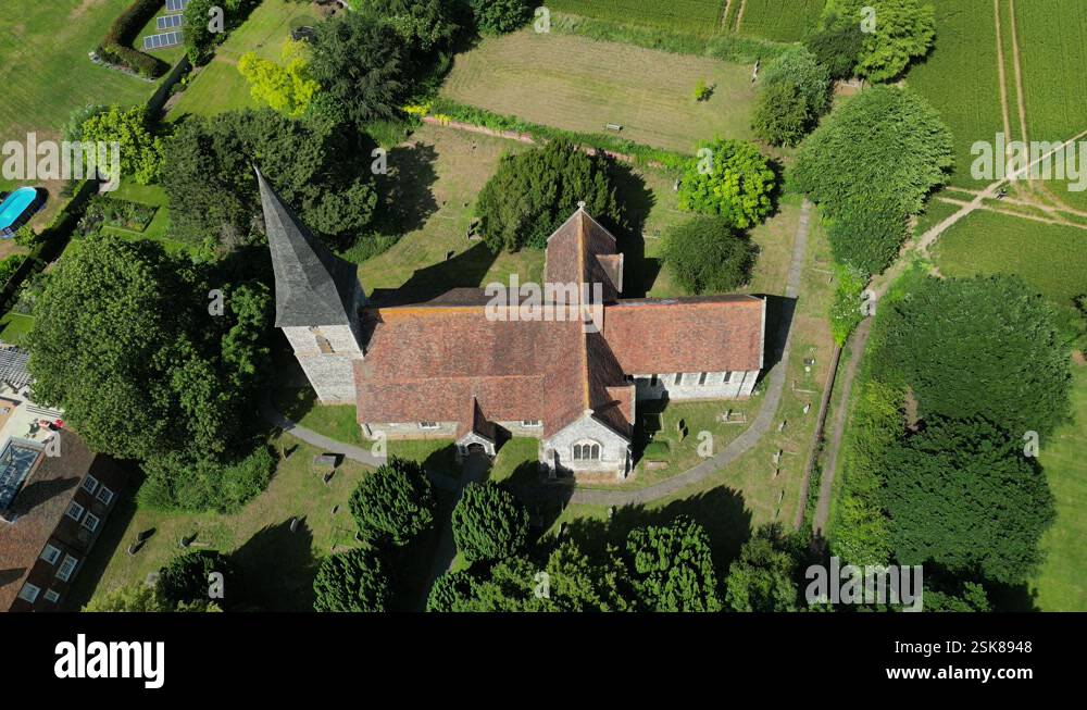 A slow top-down pan of St John the Evangelist church in Ickham, Kent ...