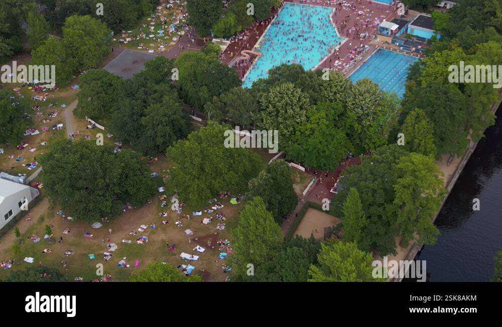 crowded public swimming pool, city Berlin. Nice aerial top view flight ...