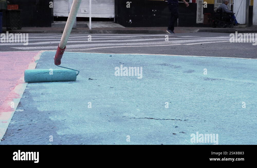 Witness the transformation of a street as vibrant shades of blue come ...