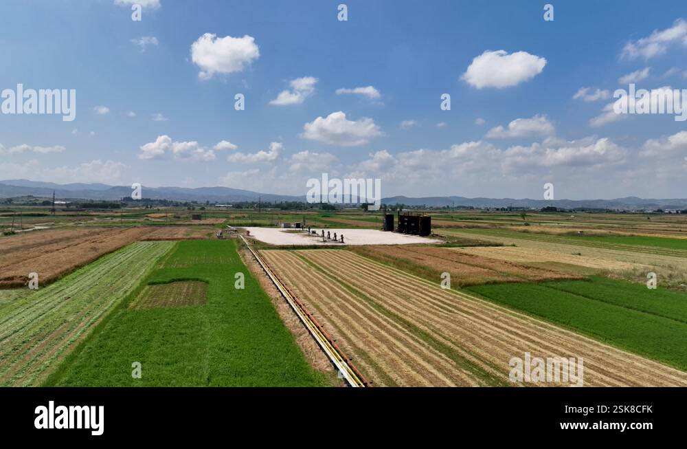 Crude Oil storage tanks in the middle of farming lands in the ...