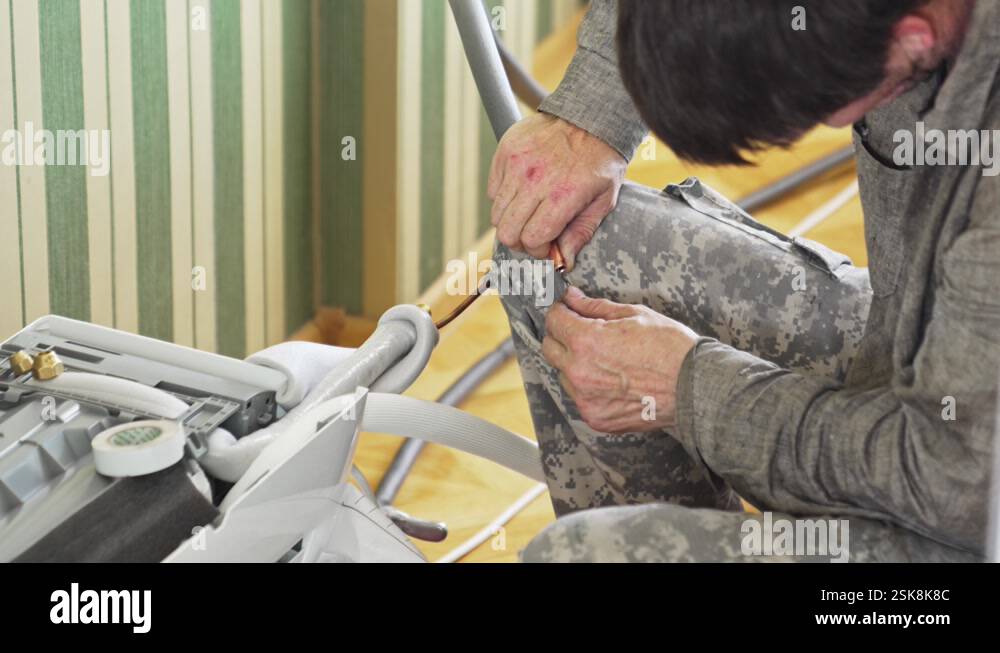 Chamfering of copper pipe. process of removing pointed edge at end of ...