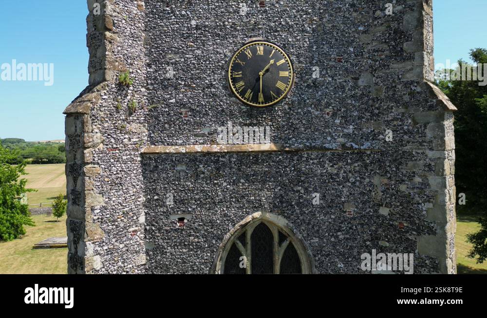A crawling boom-shot of the tower of St Mary's church in Chartham ...