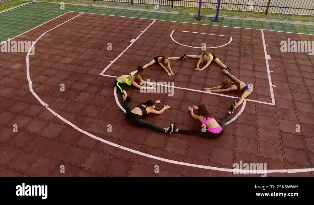 Group of People doing sport and physical exercises outdoor with friends ...