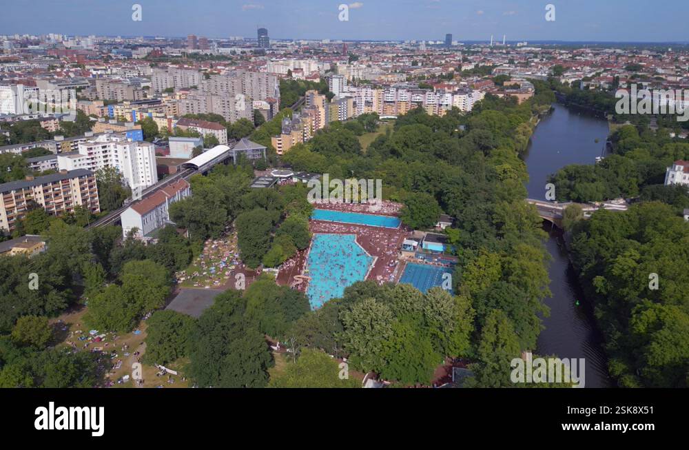 Great aerial top view flight overcrowded public swimming pool ...