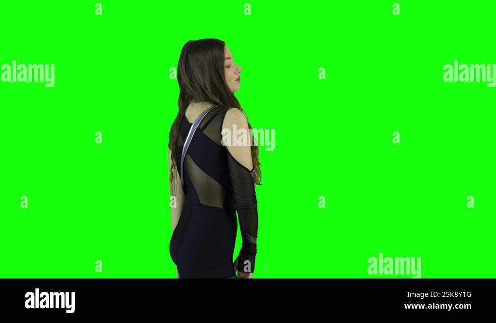 Portrait side view of a beautiful female model acting in front of a ...