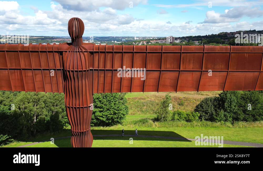 Close aerial view of the Angel of the North statue, to a wide view ...