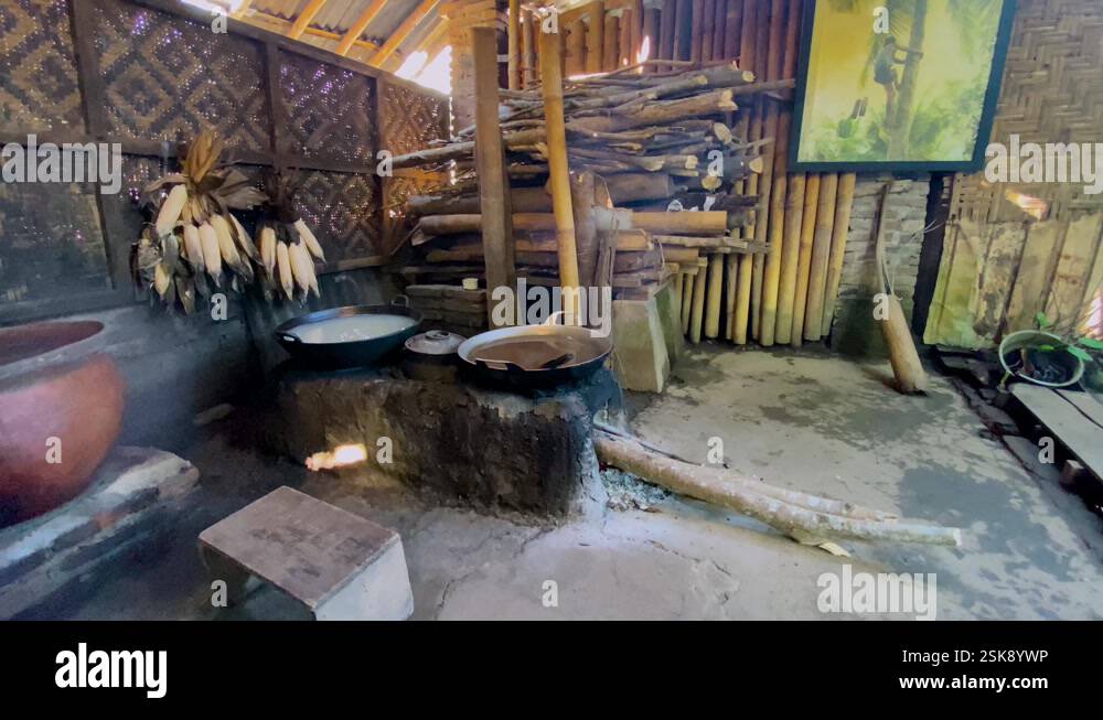 Traditional Javanese kitchen with wood-fired fire stove and large pan ...