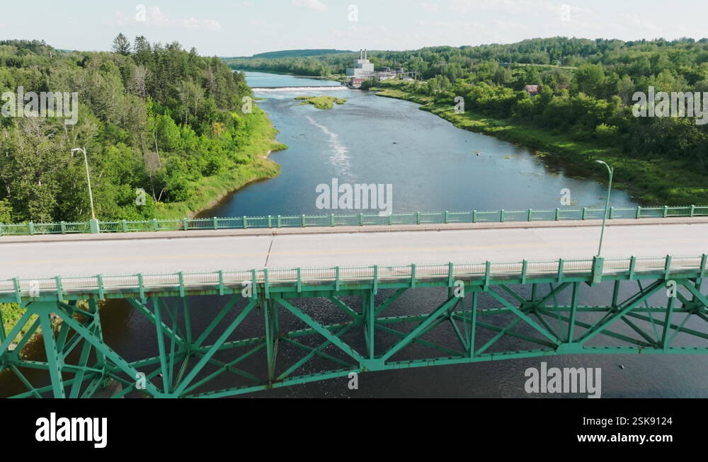 High Aerial Shot Flies Over Bridge with Hydroelectric Dam and Power ...