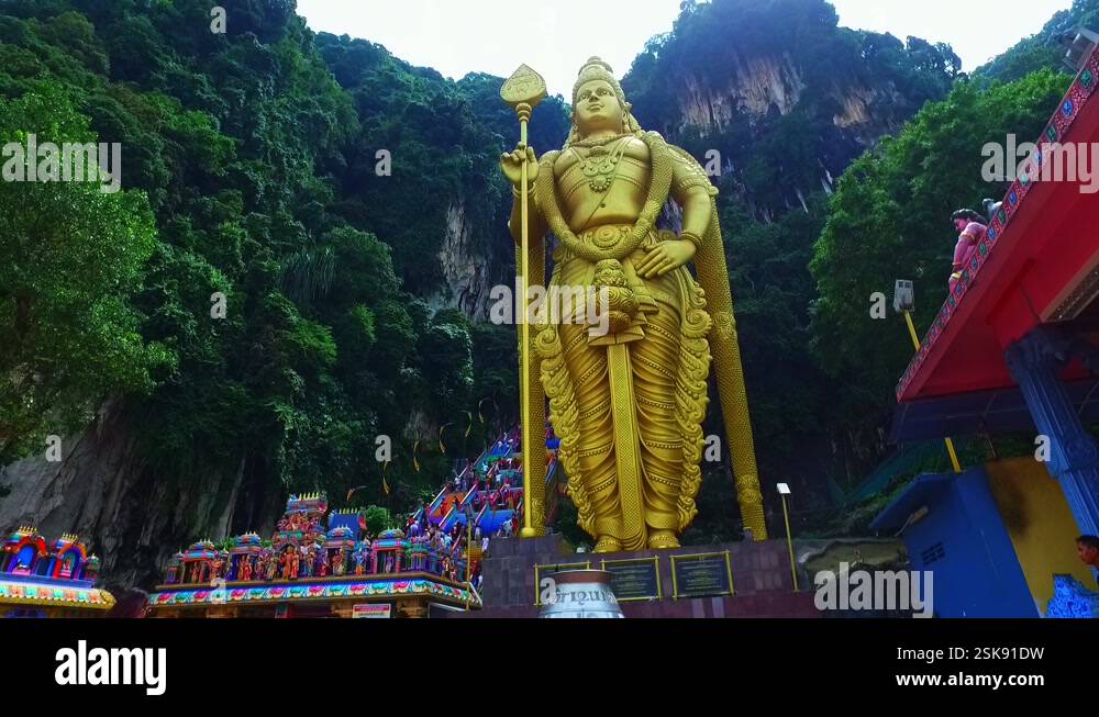 Giant Golden Murugan Statue Outside the Batu Caves Stock Video Footage ...