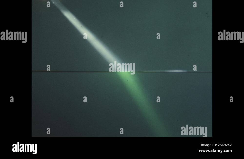 1960s: Light beam refracts off glass in optics lab Stock Video Footage ...