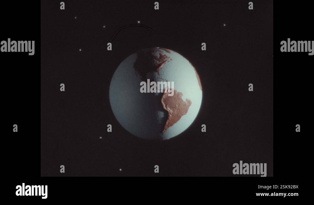 1960s: round globe of Earth in space with relief models of North, South ...