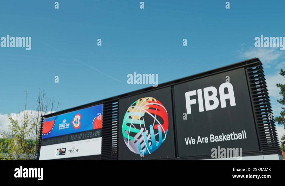 Tilt down of sign with the International Basketball Federation (FIBA ...