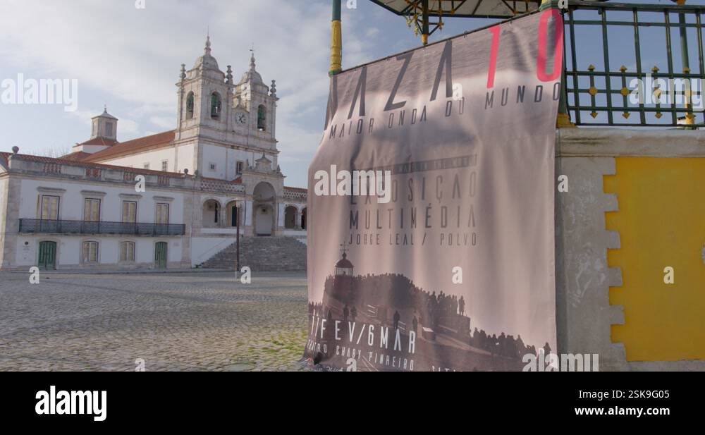 The church behind Nazare signage seaside town center in Portugal Stock ...